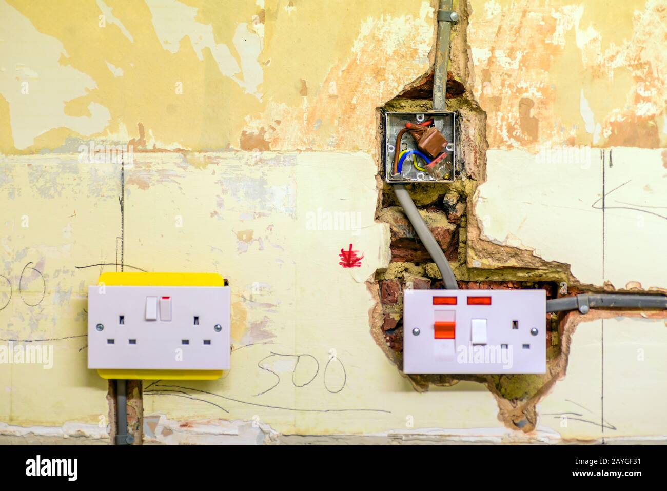electric socket in a wall during renovation in england uk Stock Photo ...