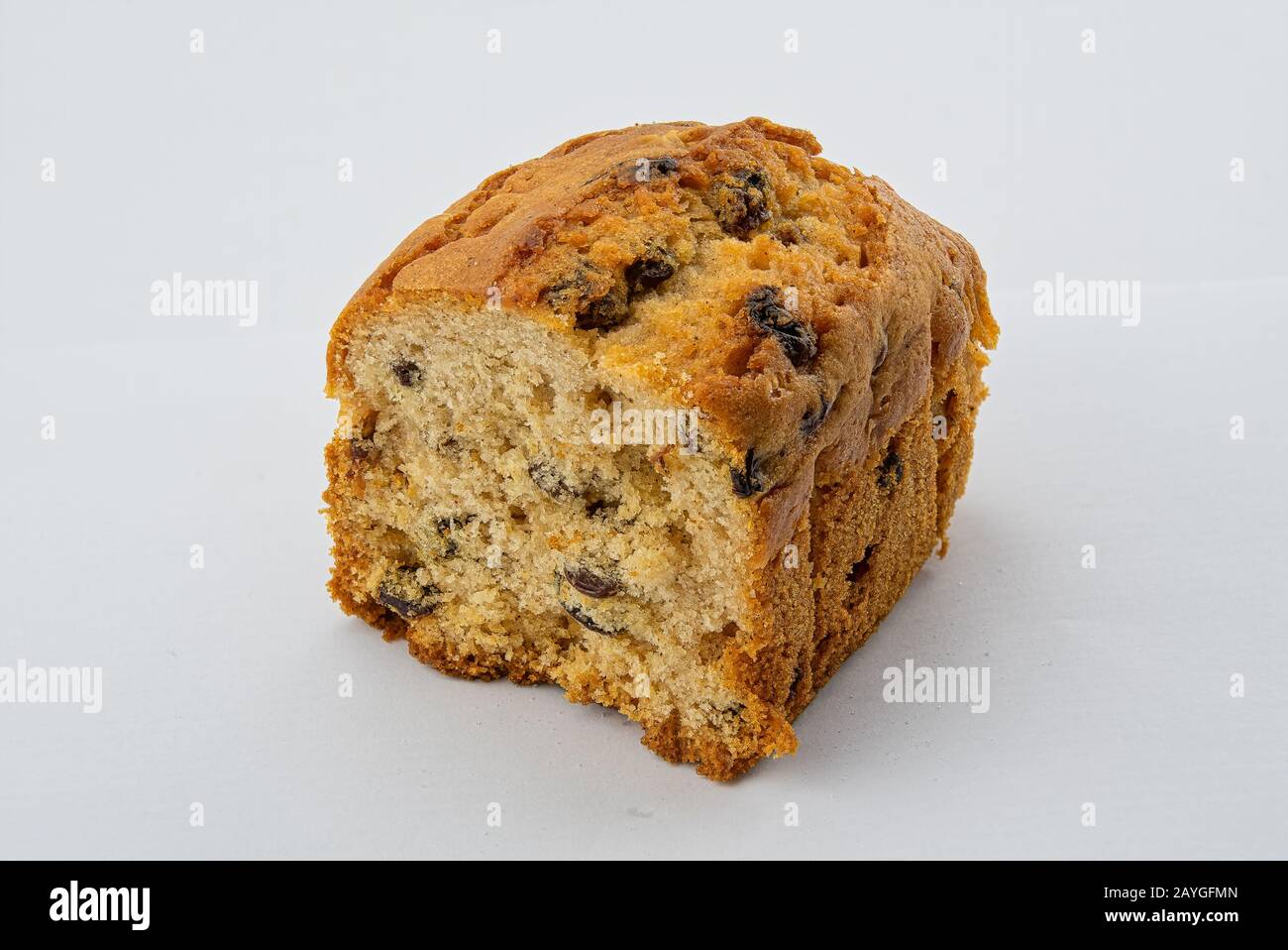 A cut fruit cake on a white background Stock Photo - Alamy