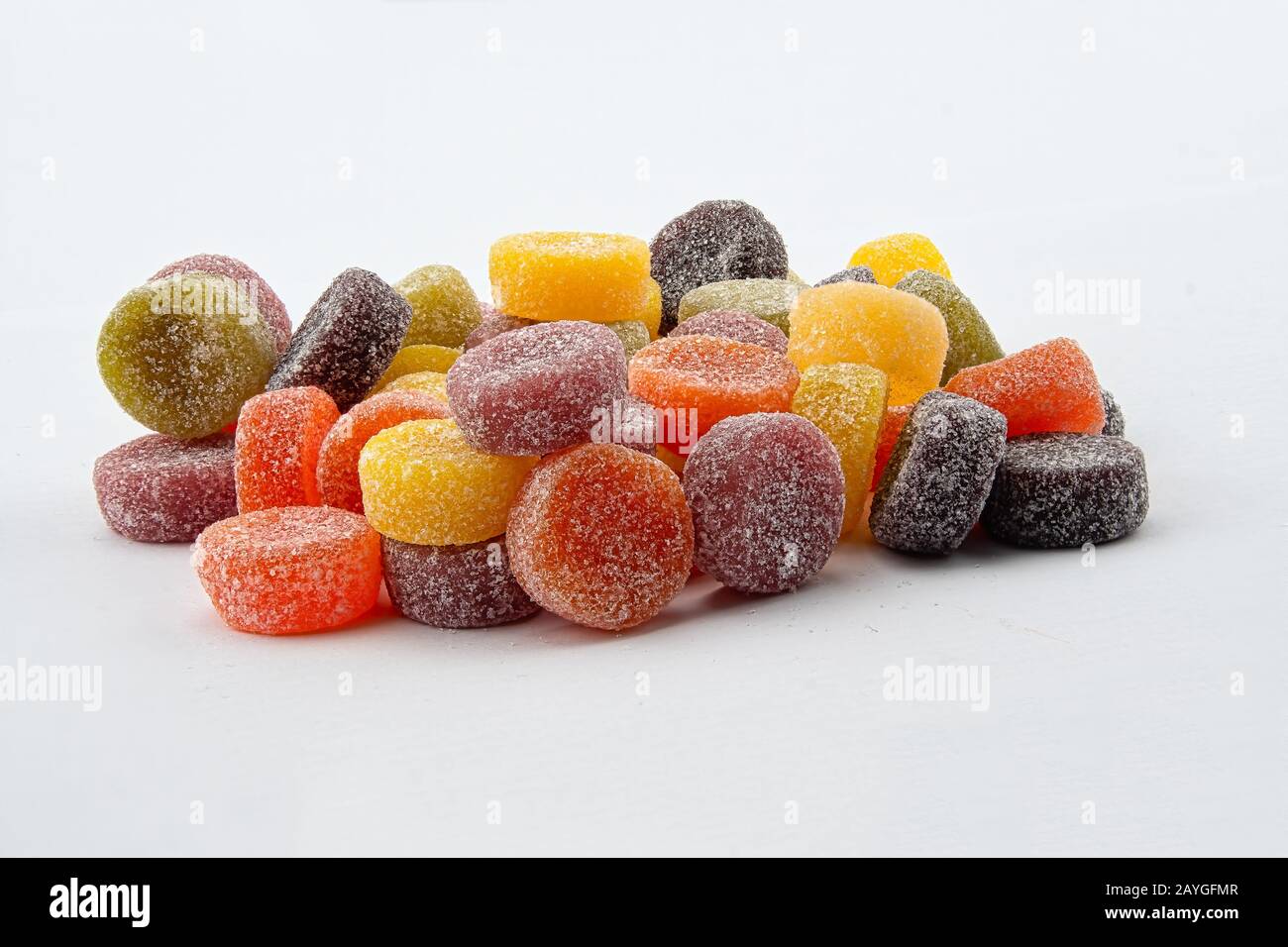 A pile of fruit pastille sweets on a white background Stock Photo - Alamy
