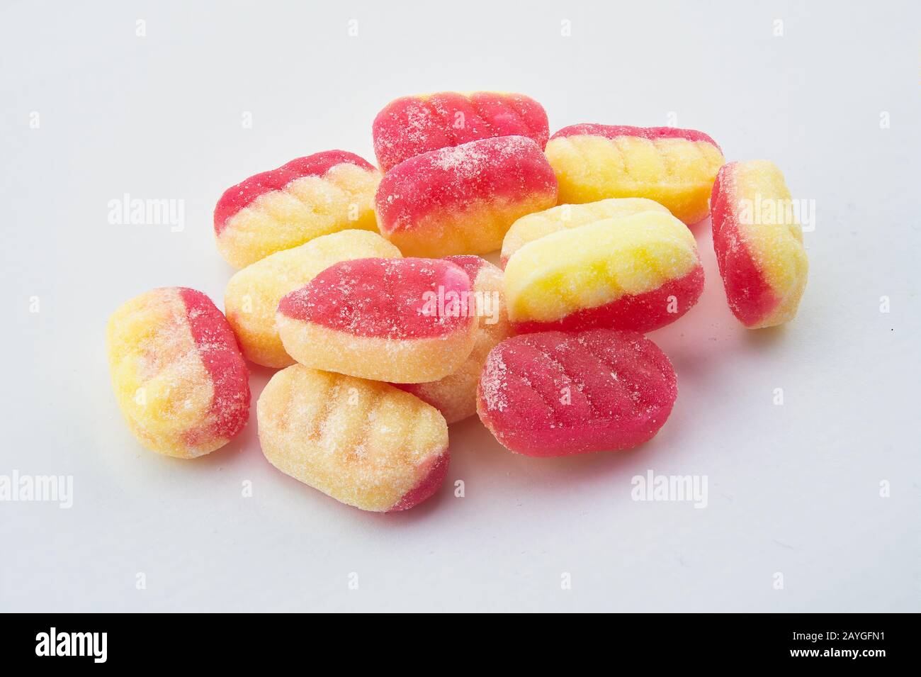 A pile of Rhubarb and Custard candy on a white background Stock Photo ...