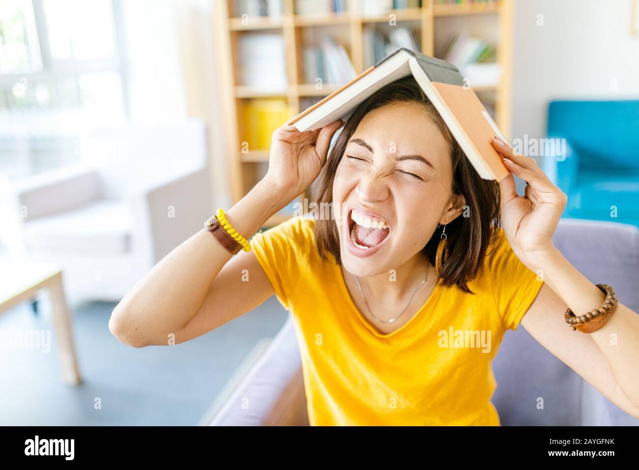 Stressed teen with books hi-res stock photography and images - Alamy