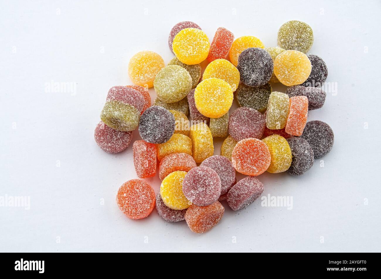 A pile of fruit pastille sweets on a white background Stock Photo - Alamy