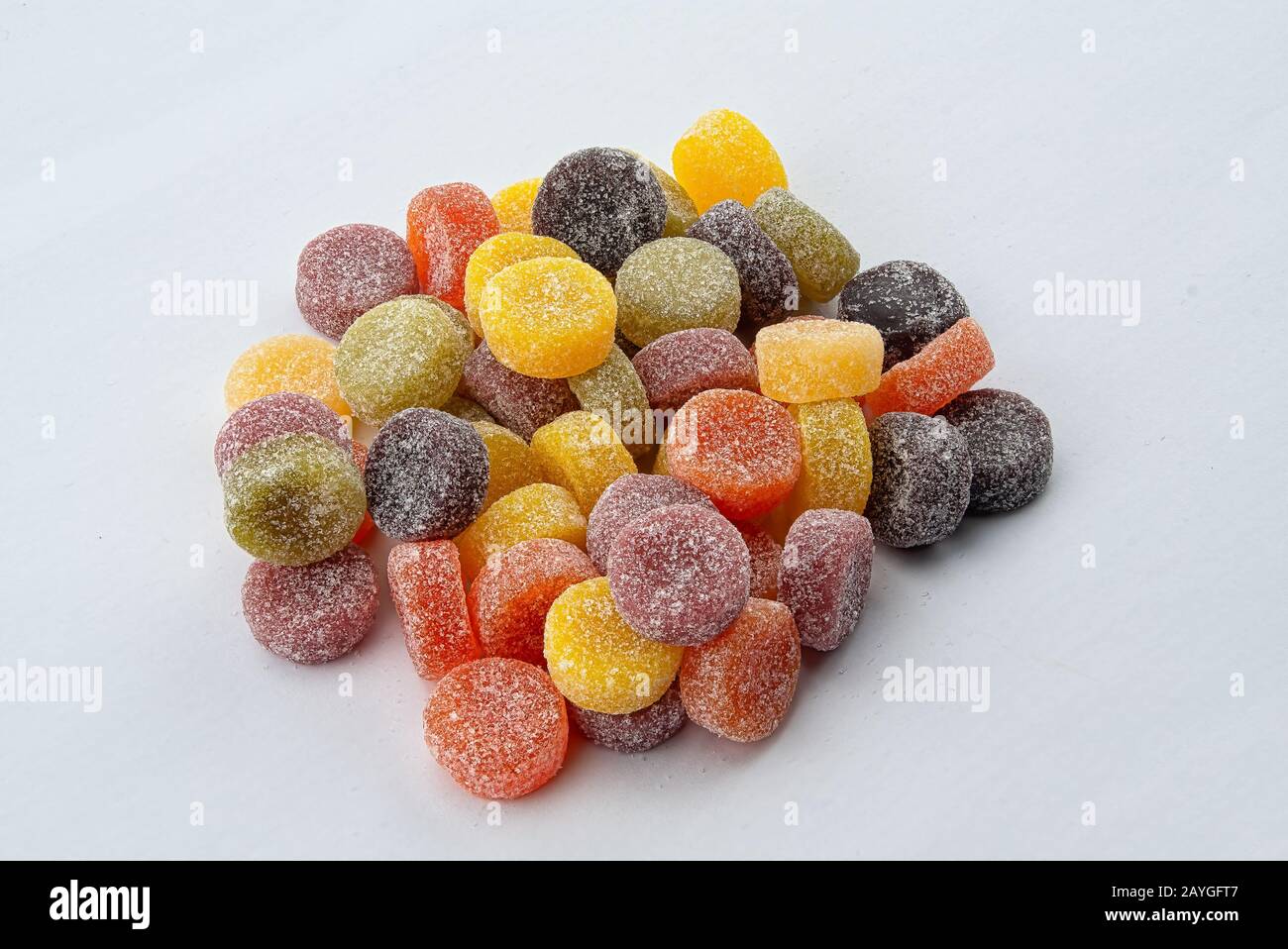 A pile of fruit pastille sweets on a white background Stock Photo - Alamy