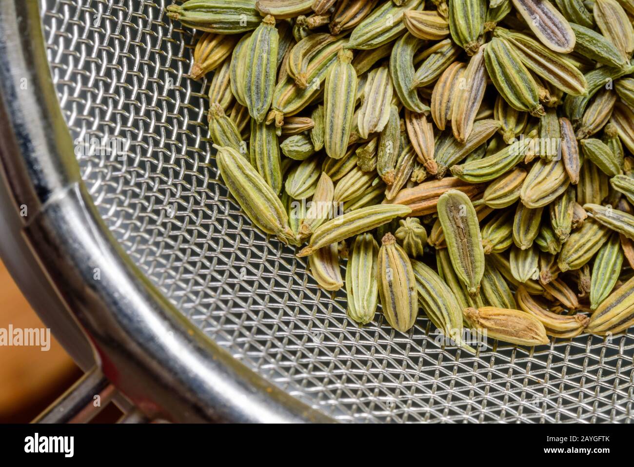 fennel seeds inside sieve ready to be brewed for healthy drink Stock ...