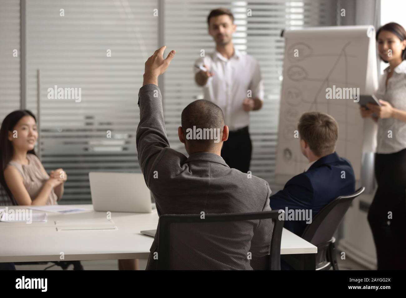 Businesspeople raise hands ask question hi-res stock photography and ...