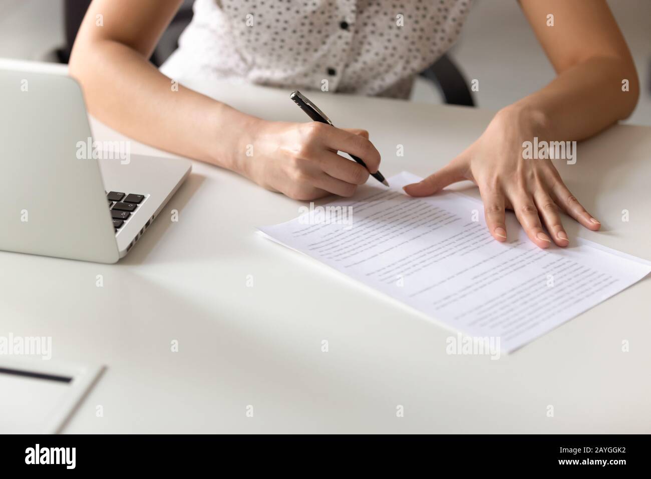 Close up of female employee handwriting letter Stock Photo - Alamy