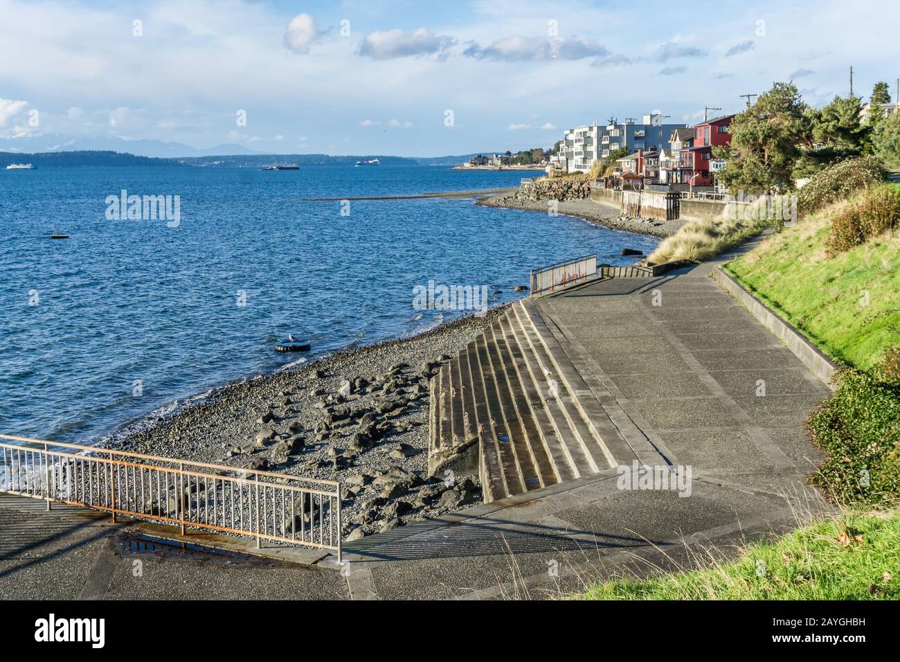 Stairs on a sea wall in West Seattle, Washington lead to the water ...