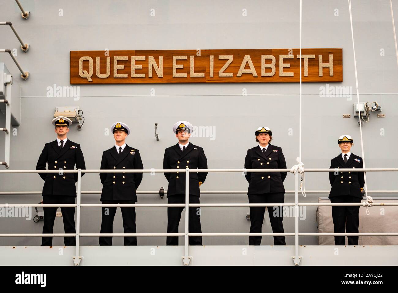 Sailors man the rails of the Royal Navy's aircraft carrier HMS QUEEN ...