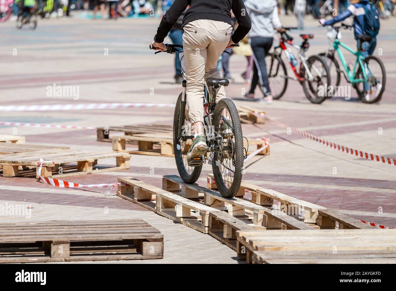 Figure bicycle riding with obstacles Stock Photo - Alamy