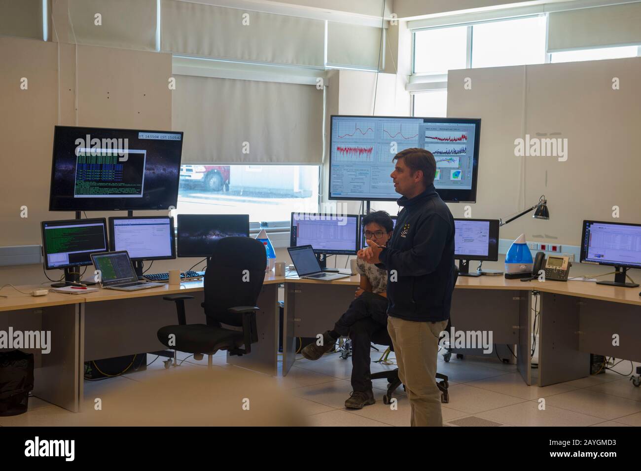 Scientist working in a control room at ALMA (Atacama Large Millimeter ...