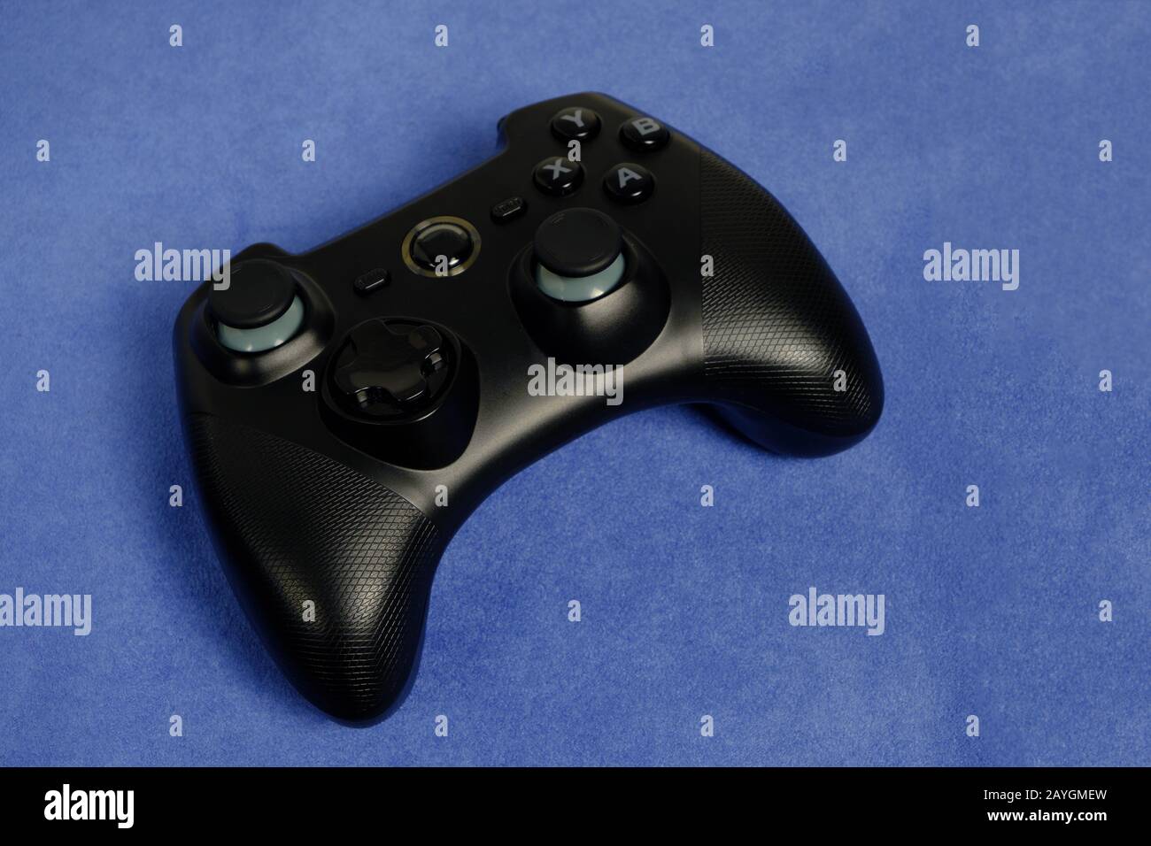 Playing joystick on a blue background.Games and entertainment Stock ...