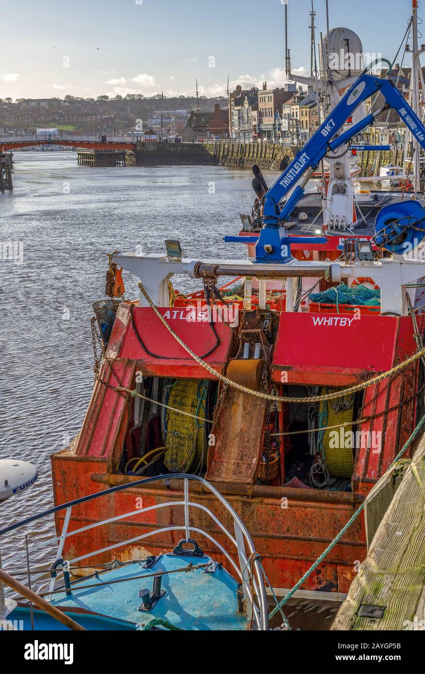 Whitby harbour with a fishing trawler prominent in the foreground, The ...