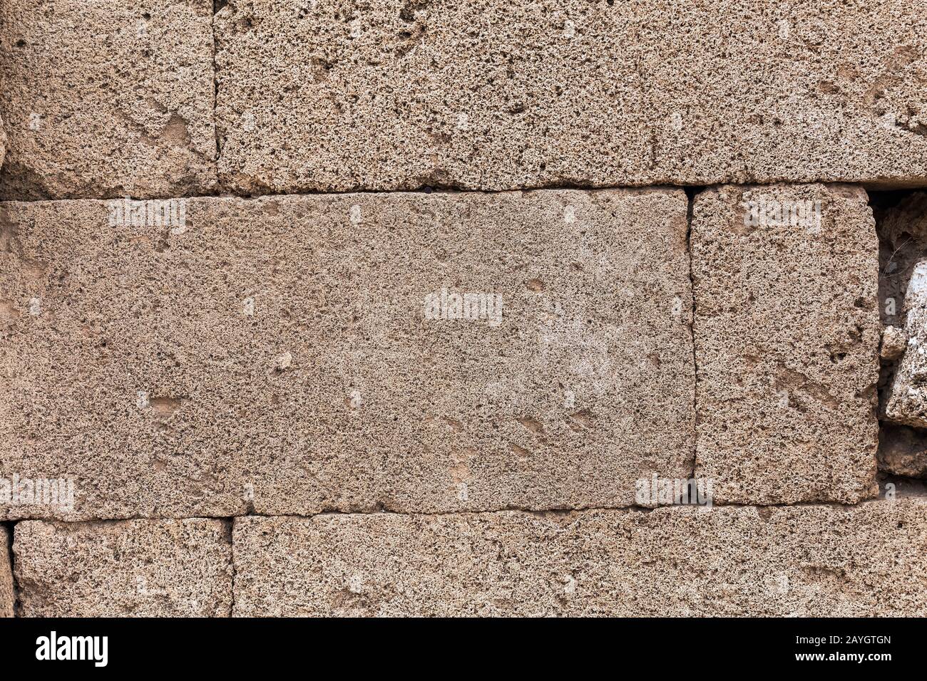 Background of ancient stone wall of a greek temple Stock Photo - Alamy