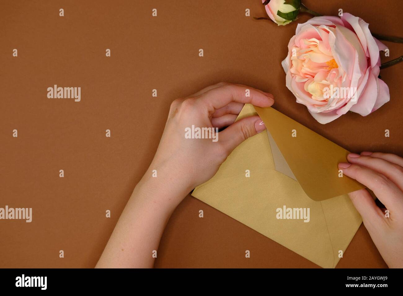 Envelope in hand Stock Photo - Alamy