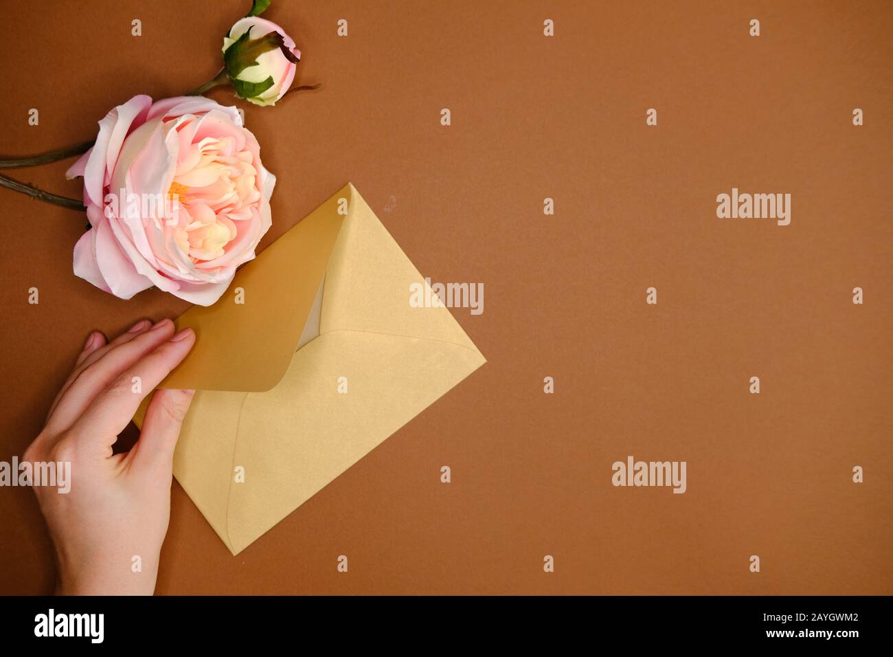 Envelope in hand Stock Photo - Alamy