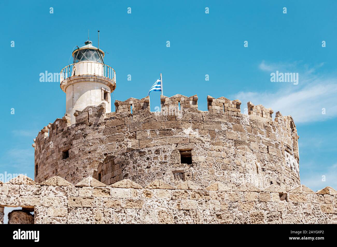 Old fortification and lighthouse on Rhodes island, Greece Stock Photo ...