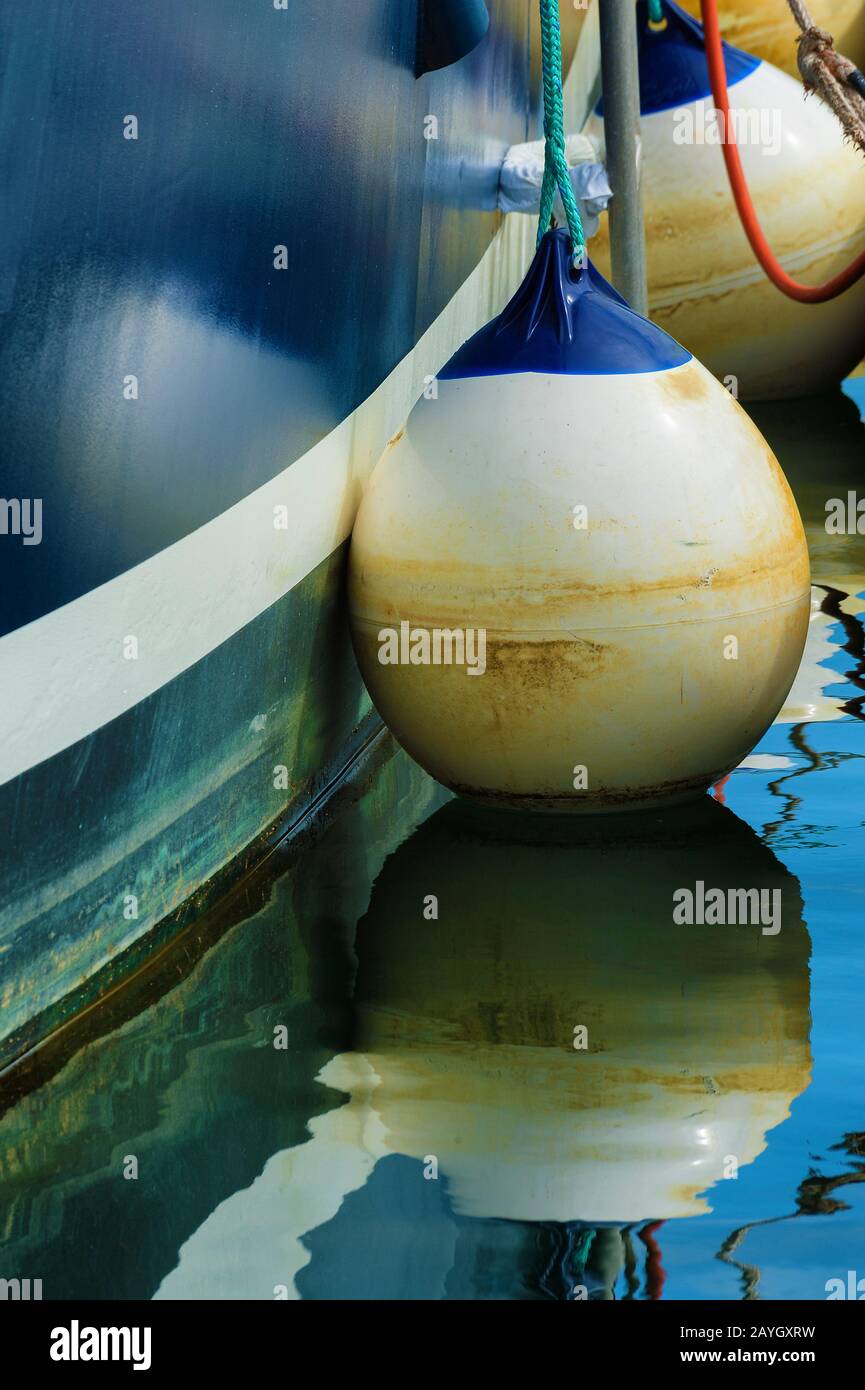 Close up of a boats buoys hanging off it's side in Newport Marina on ...