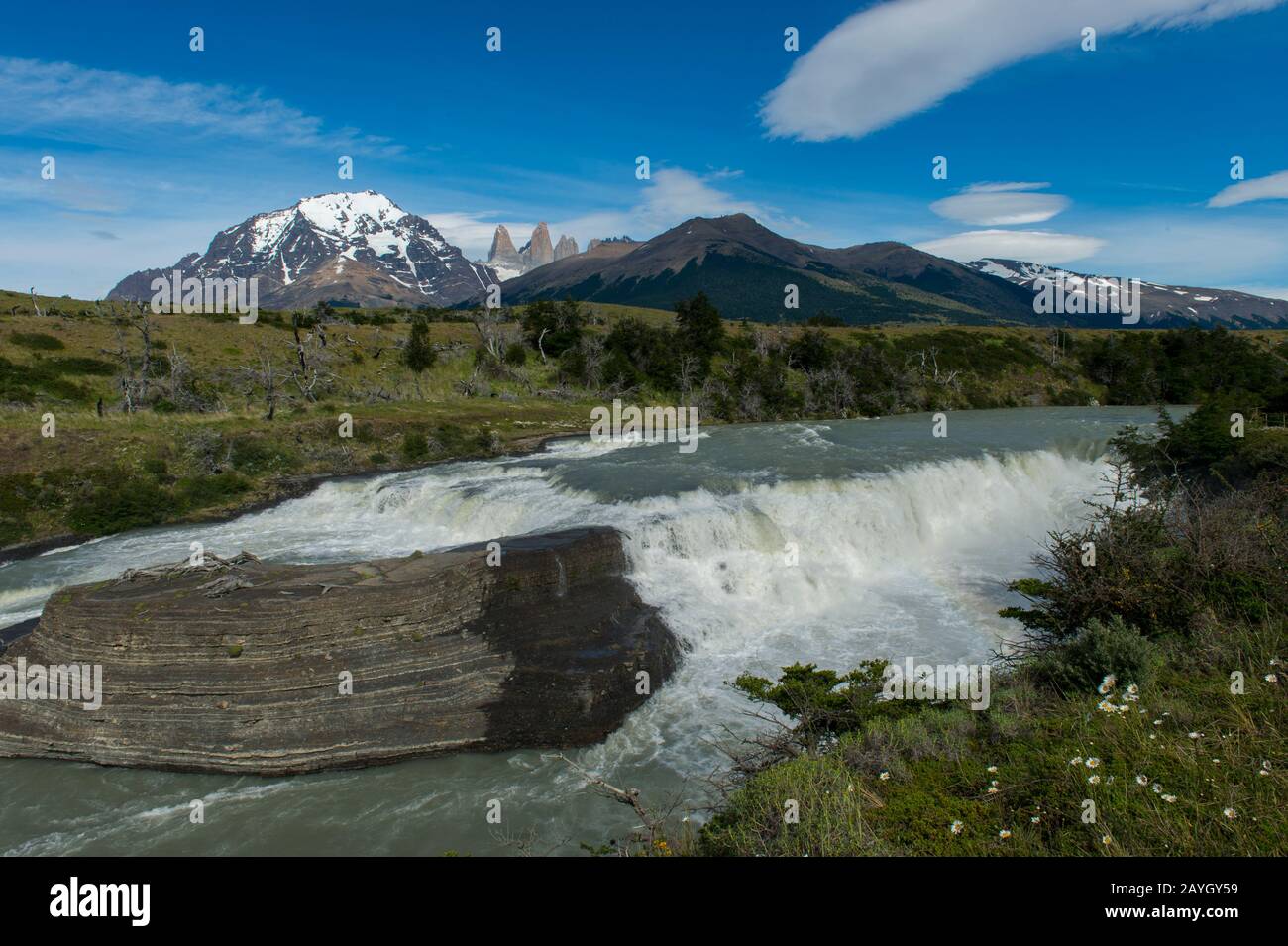View of the Paine River waterfall with Admiral Nieto Mountain (left ...