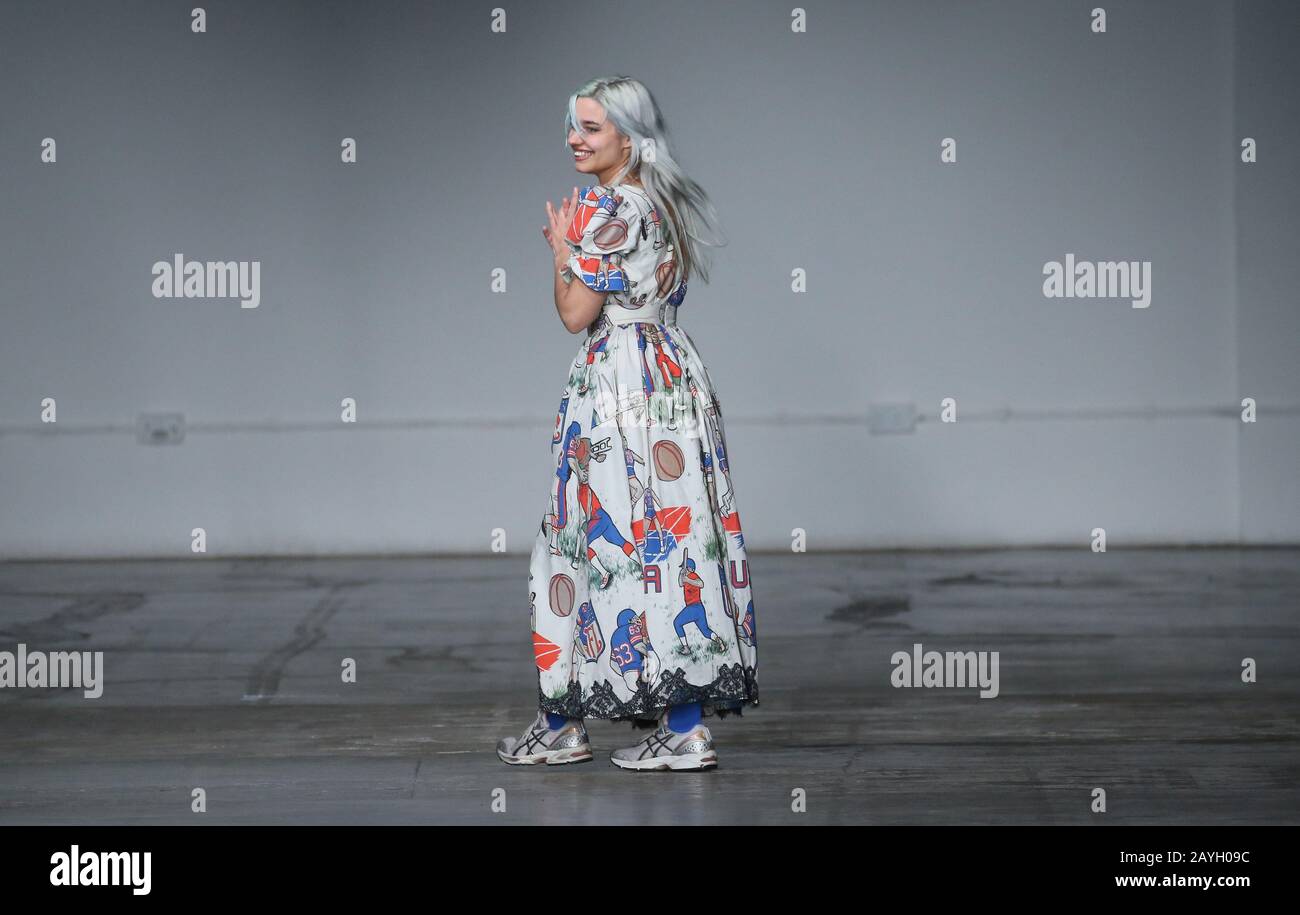 Designer Mimi Wade acknowledges the audience following the catwalk ...