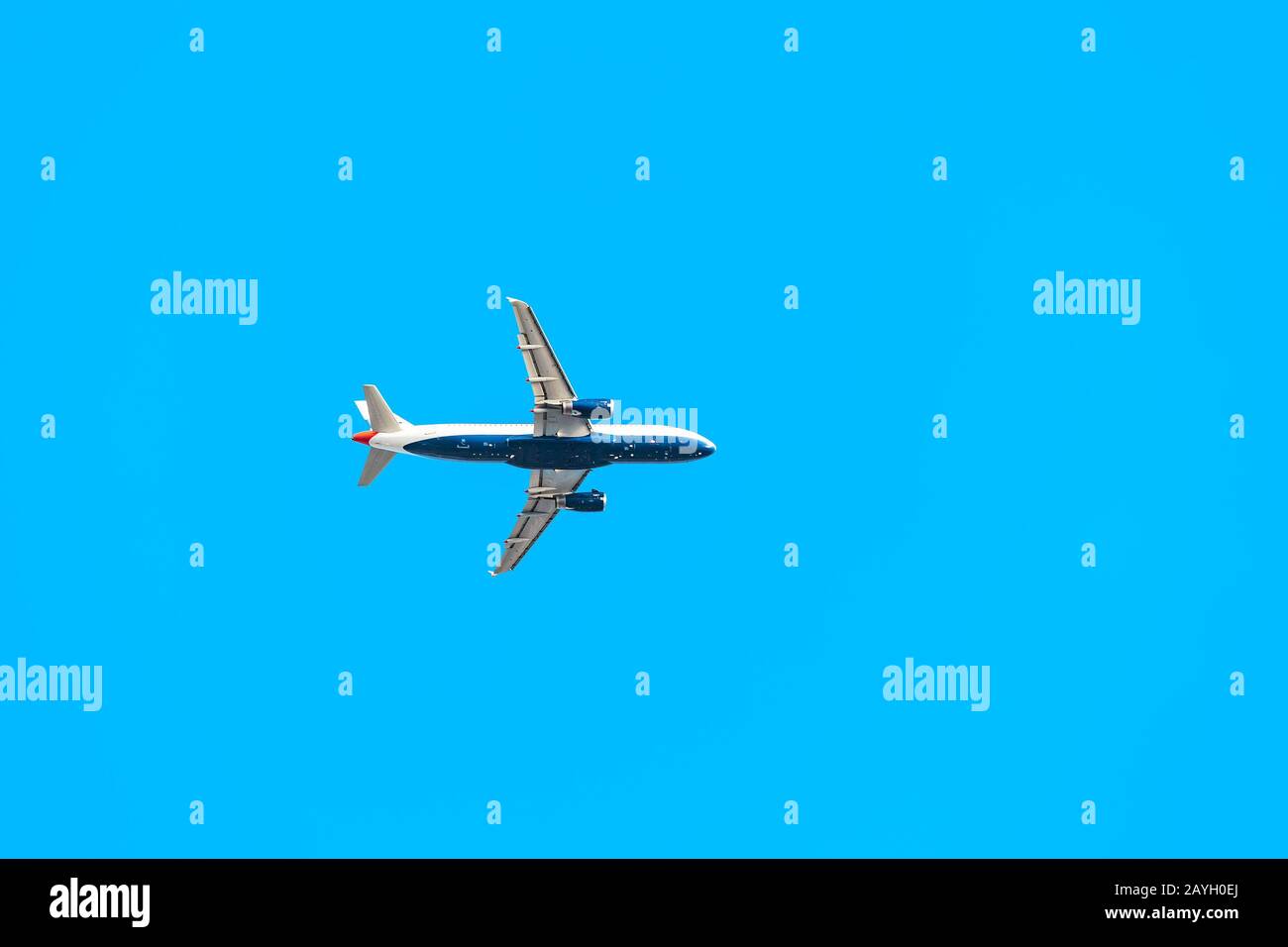 Flying airplane bottom view Stock Photo - Alamy