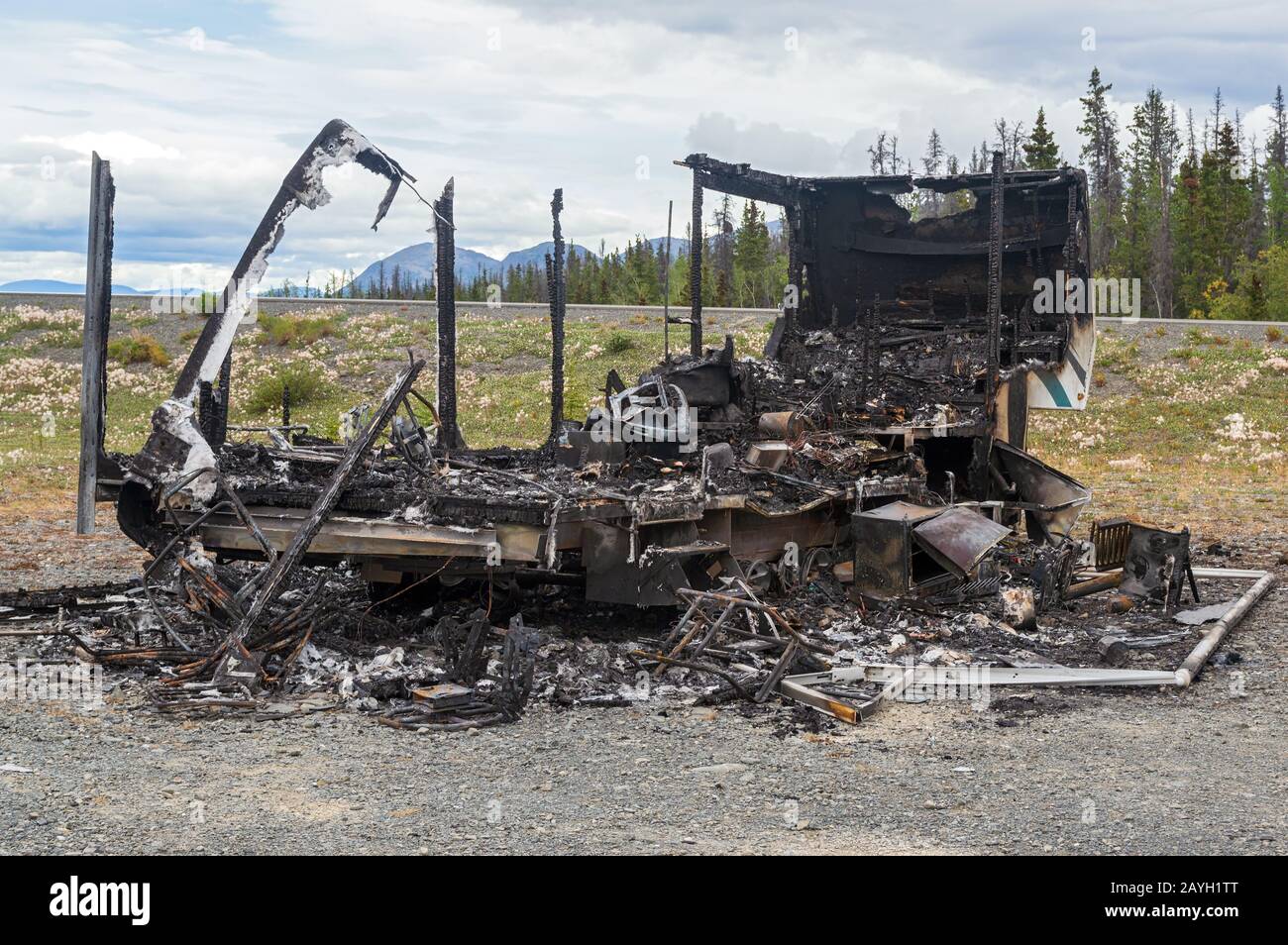 The rear of a burned out trailer by the side of the road Stock Photo ...