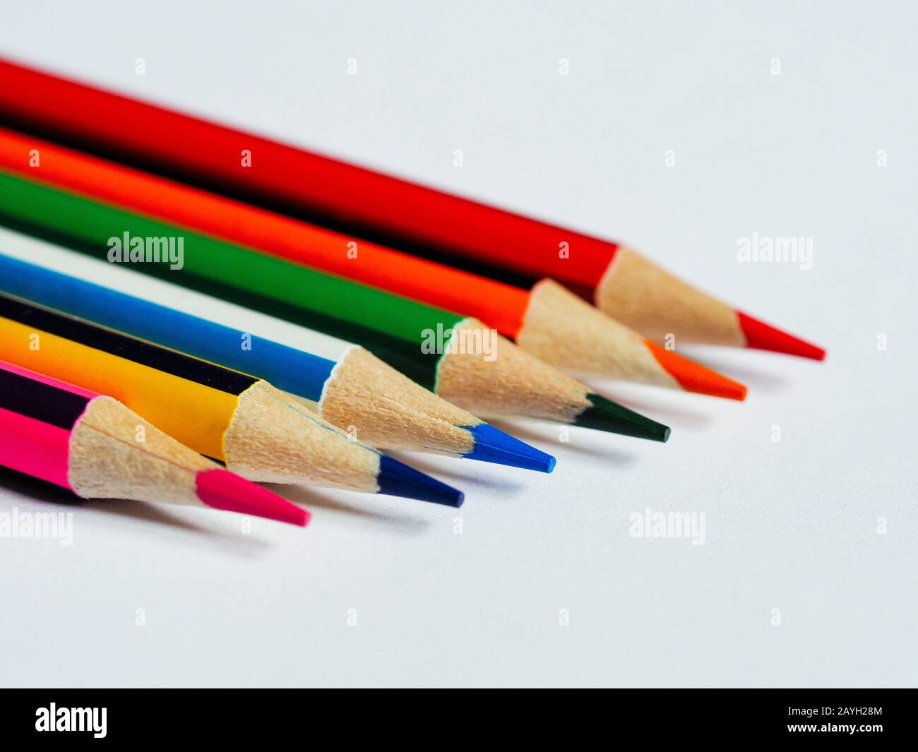 Coloured pencils on white paper Stock Photo - Alamy