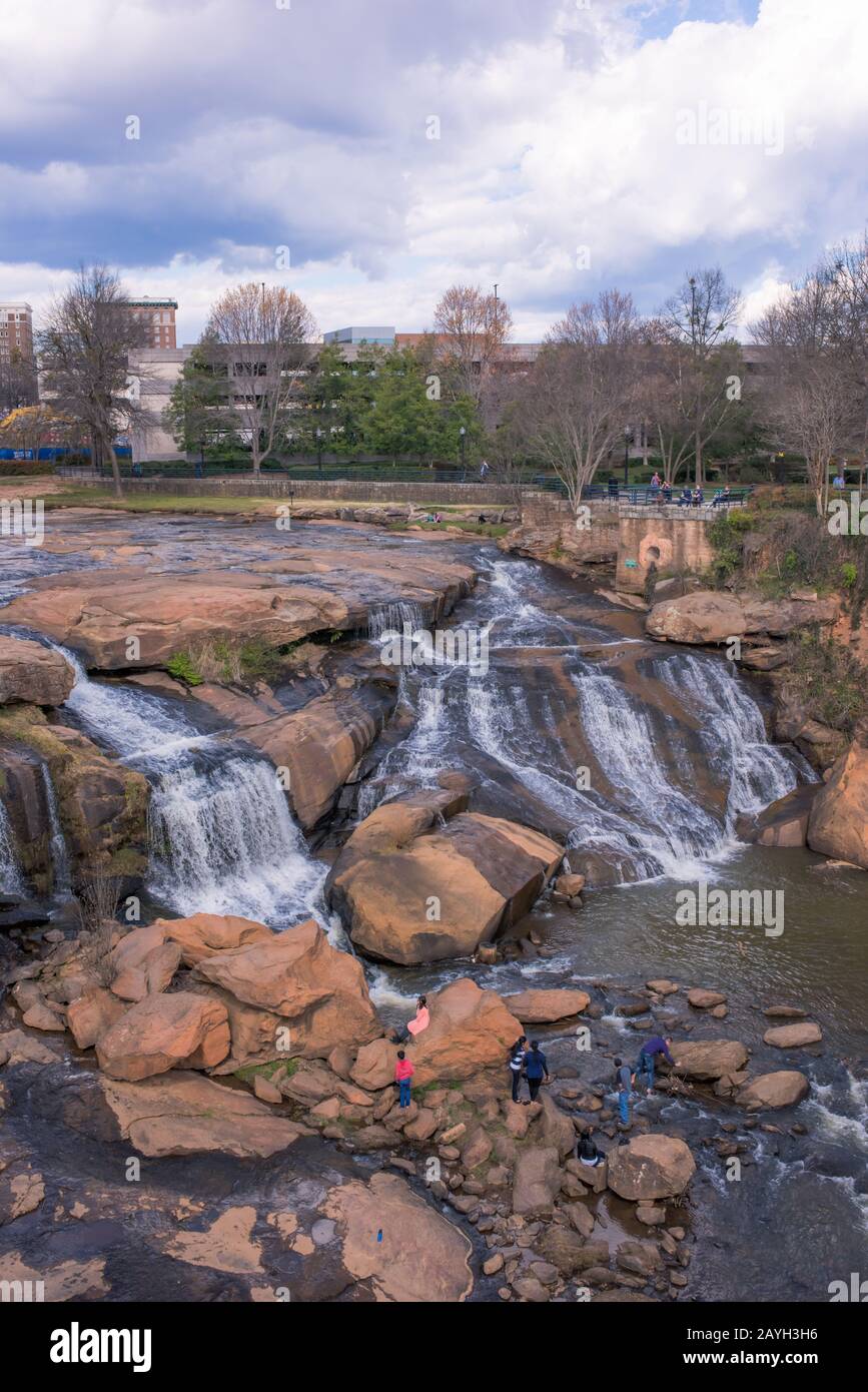 Beautiful modern buildings line the public park in downtown Greenville ...