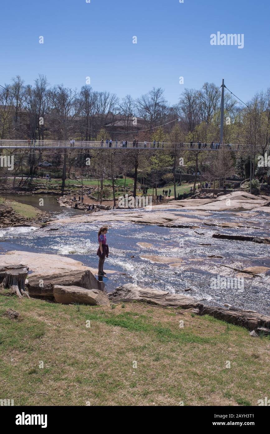 The Liberty Bridge at Falls Park at the Reedy is an iconic landmark in downtown Greenville ...