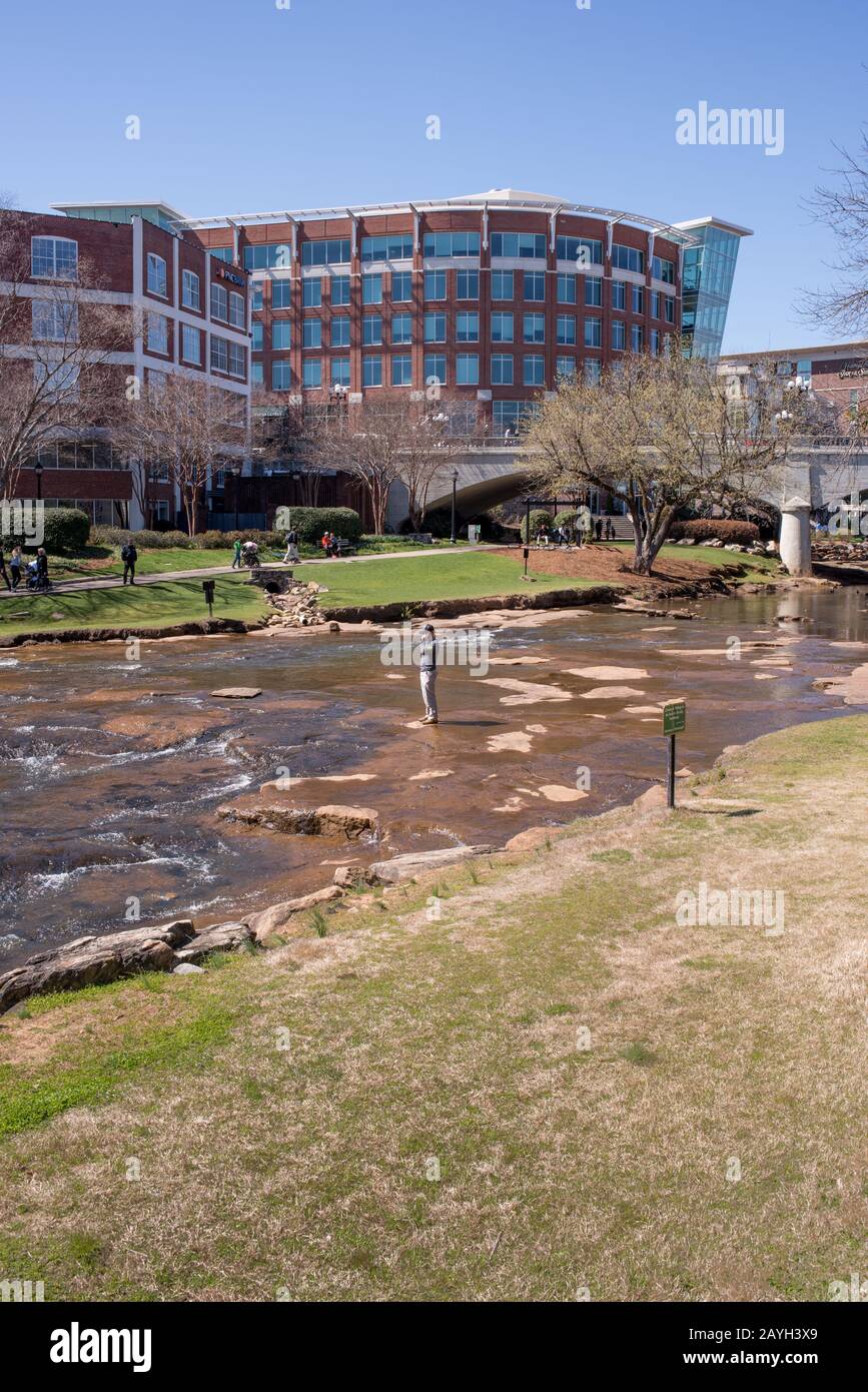 Beautiful modern buildings line the public park in downtown Greenville ...