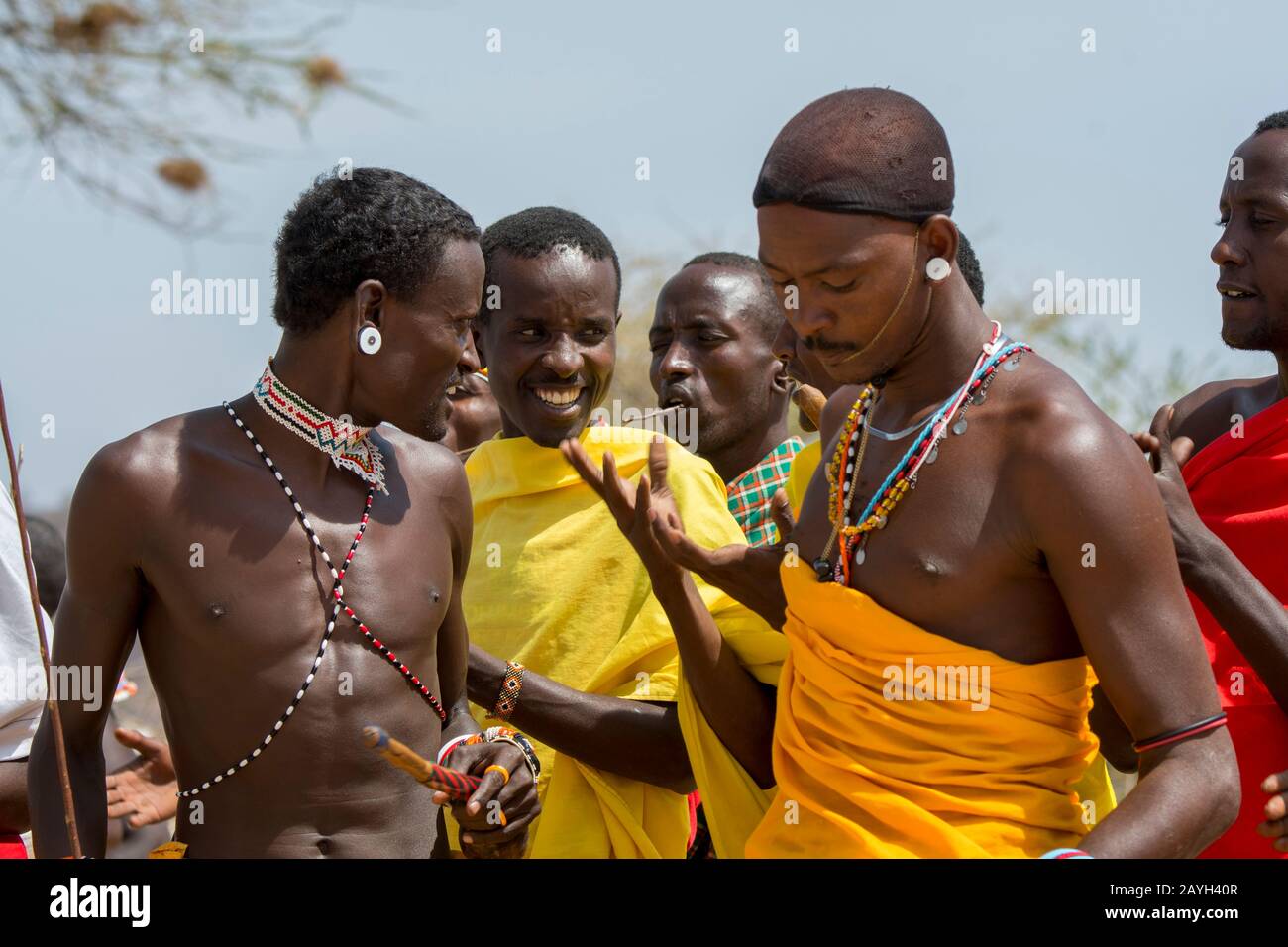 A group of young Samburu men dressed in traditional clothing at a ...