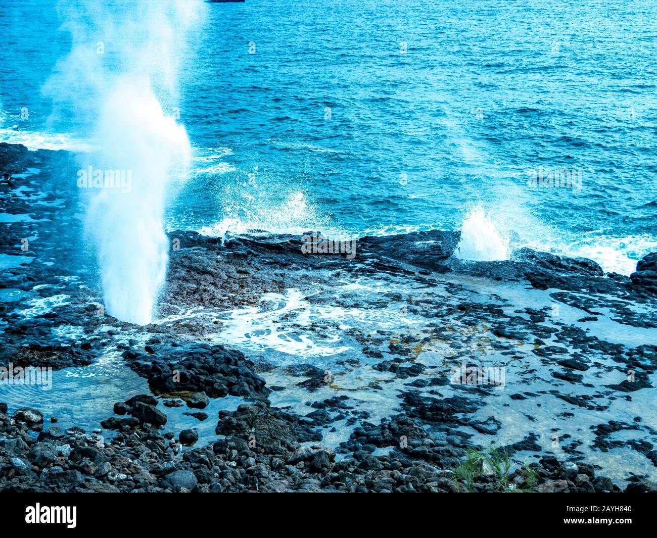 Lava blowholes in Hawaii. The ocean erodes the lava shelf underwater ...