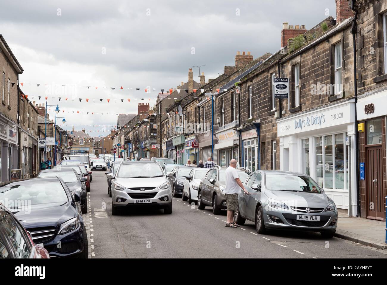 Traffic on Sunday in Queen Street, Amble, Northumberland Stock Photo ...