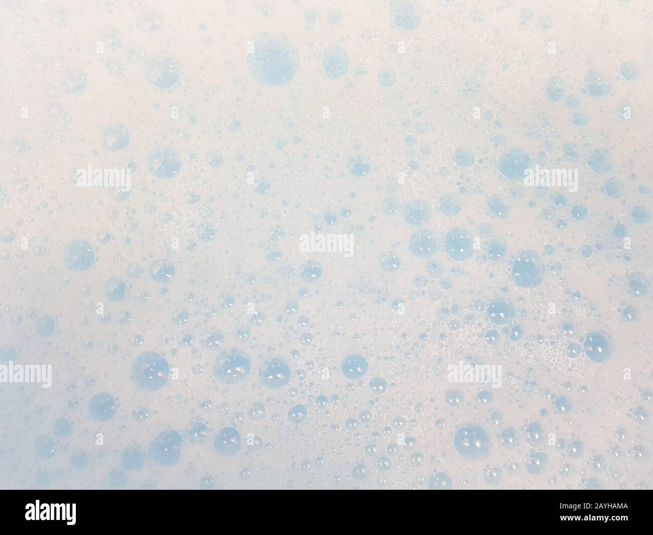 White foam with bubbles popping in blue water Stock Photo - Alamy