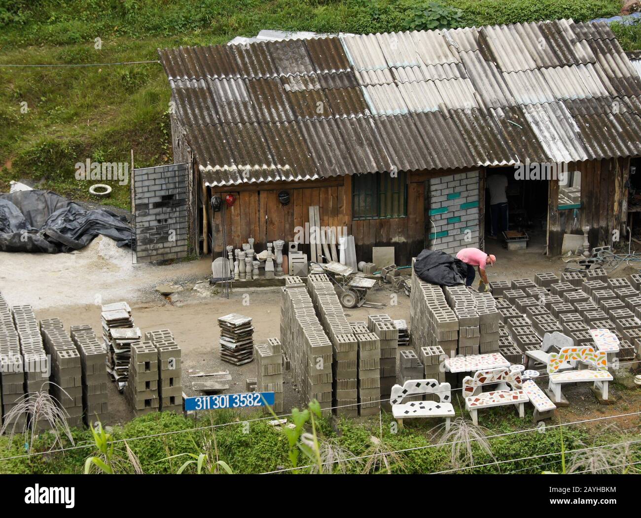 Small rural factory that manufactures concrete blocks and outdoor ...