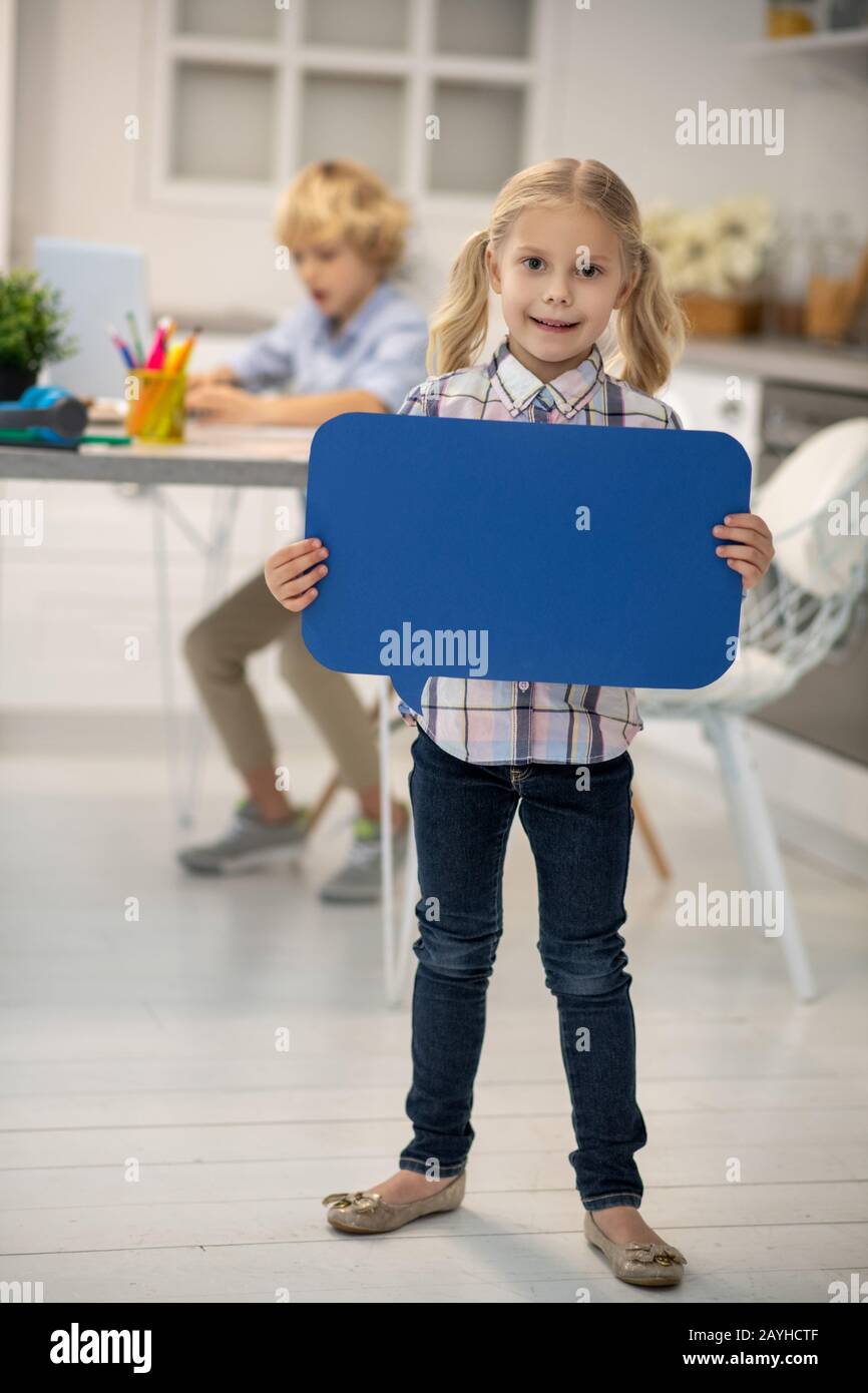 Blond kid with pony tails feeling good Stock Photo - Alamy