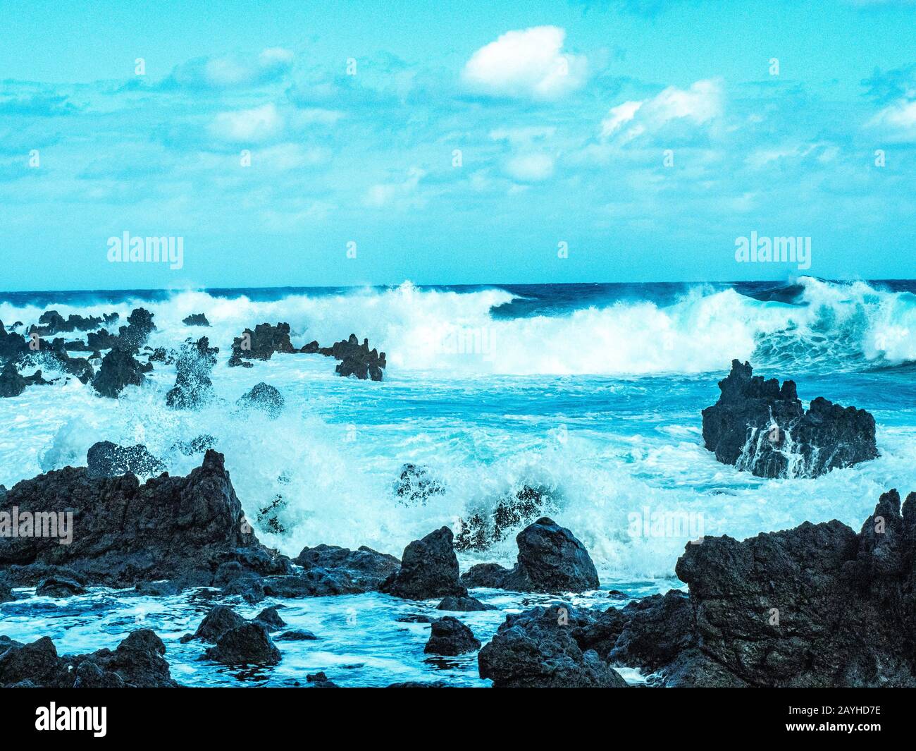 Lava blowholes in Hawaii. The ocean erodes the lava shelf underwater ...
