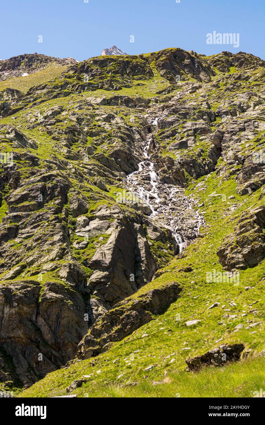 Mountain stream rushing down a steep slope Stock Photo - Alamy