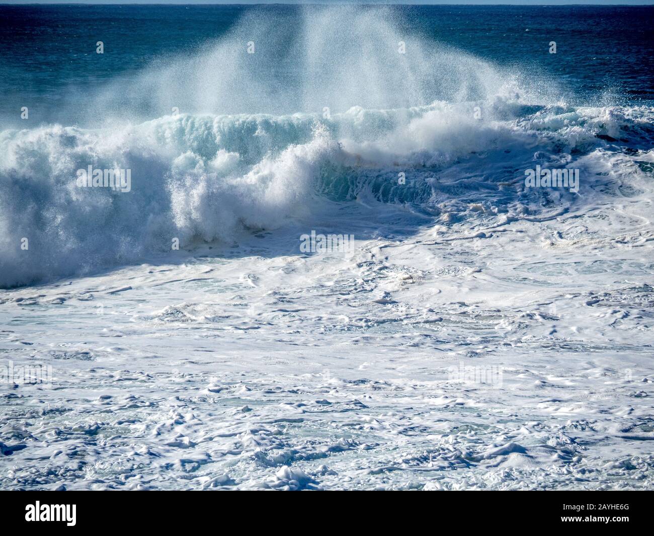 Big waves on the north shore of Oahu with aquamarine seas, white foam ...