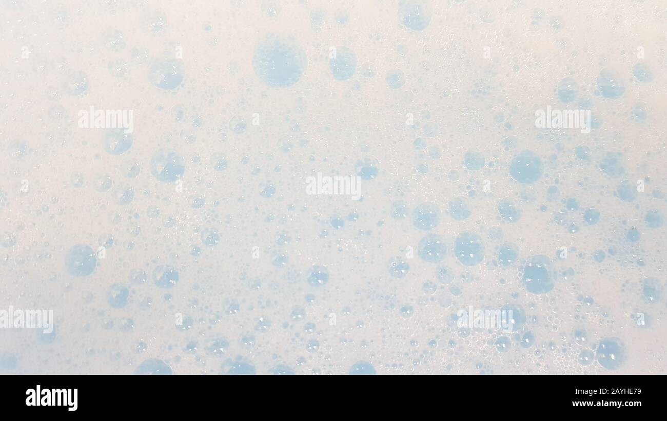 White foam with small bubbles popping in blue water Stock Photo - Alamy