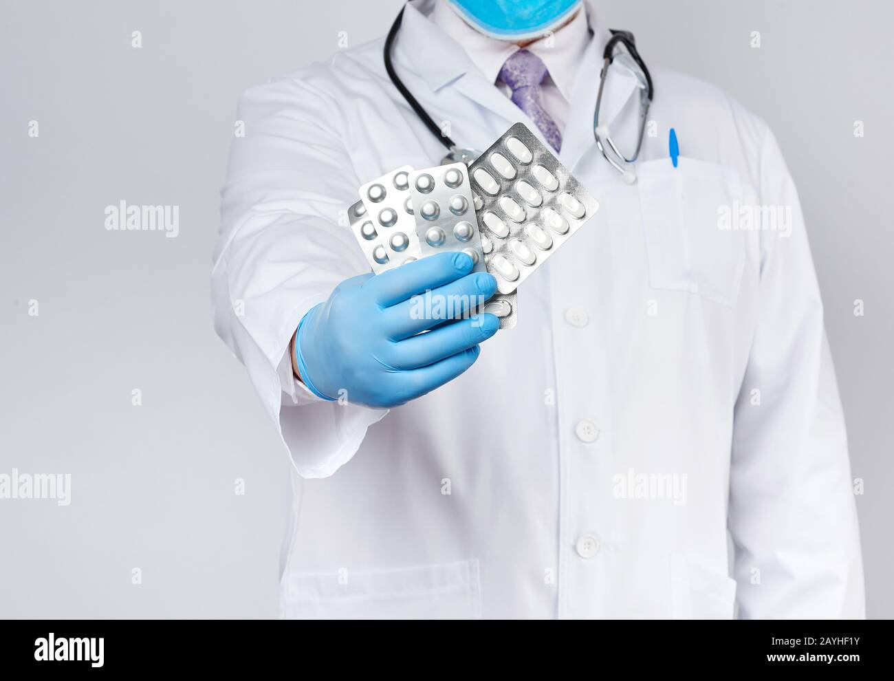 adult doctor therapist is dressed in a white uniform coat and blue ...