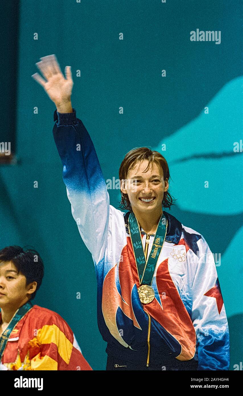 Amy Van Dyken (USA )wins the gold medal in the 100m butterfly at the ...