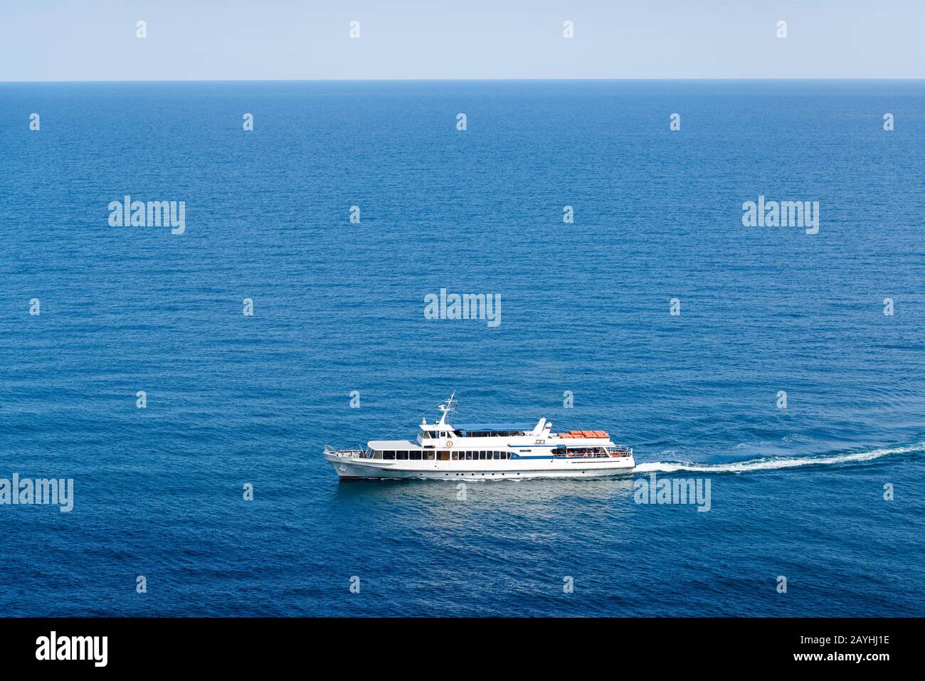 A tourist boat floats in the sea. Black Sea, Yalta, Crimea Stock Photo ...