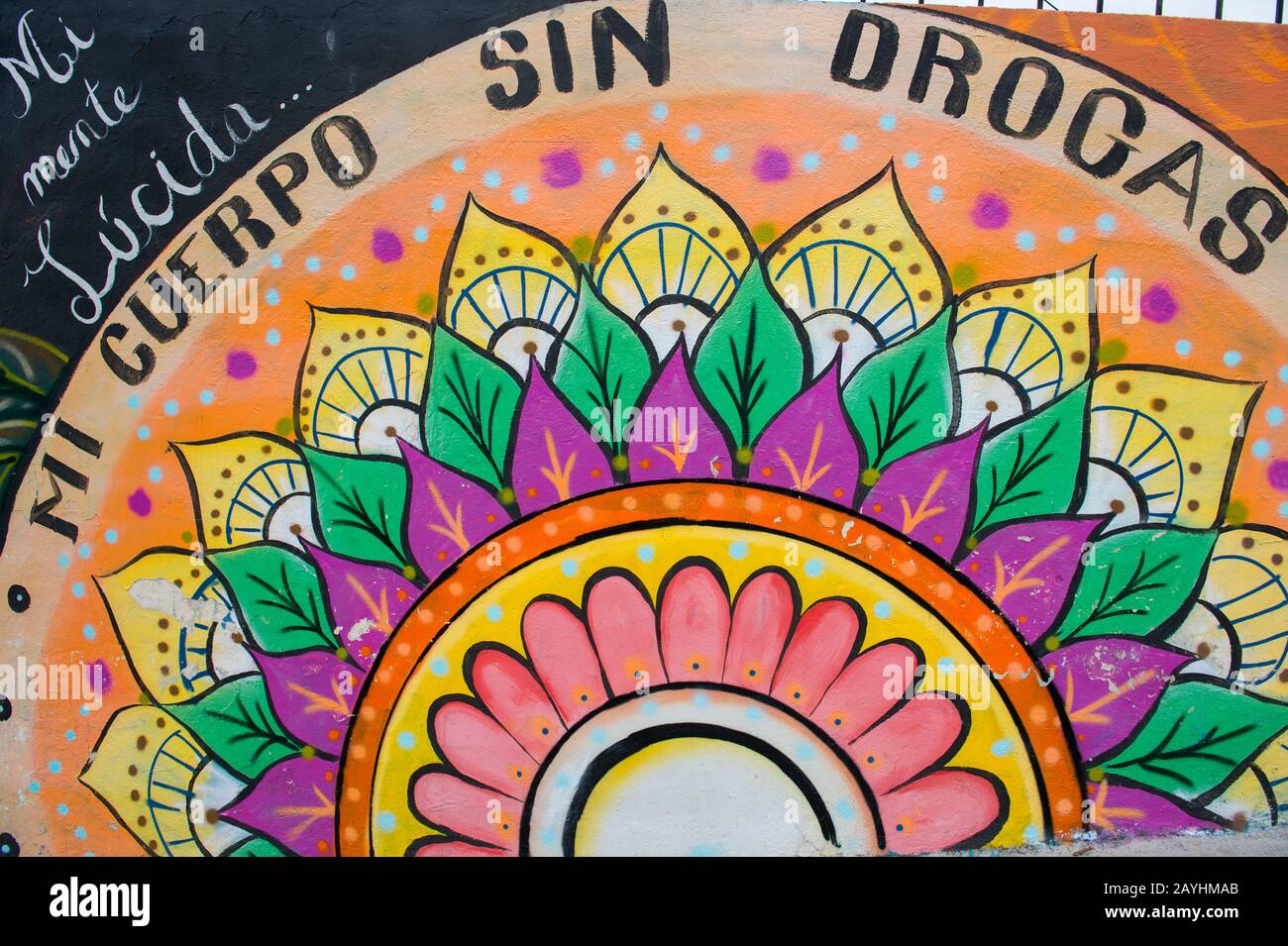 A wall painted by students with colorful murals in Quito, Ecuador Stock ...