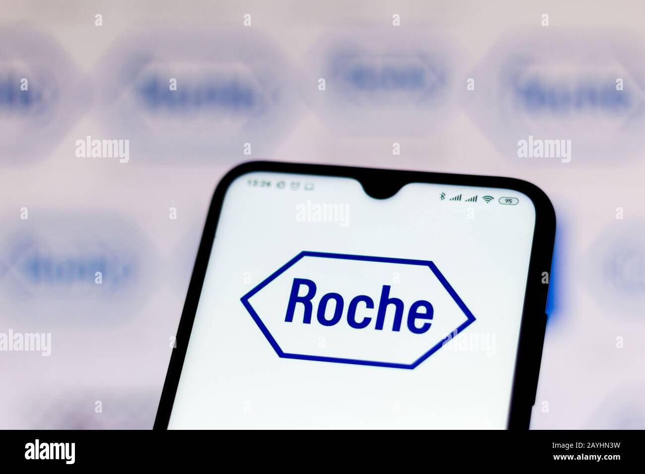 In this photo illustration the Roche website seen displayed on a ...