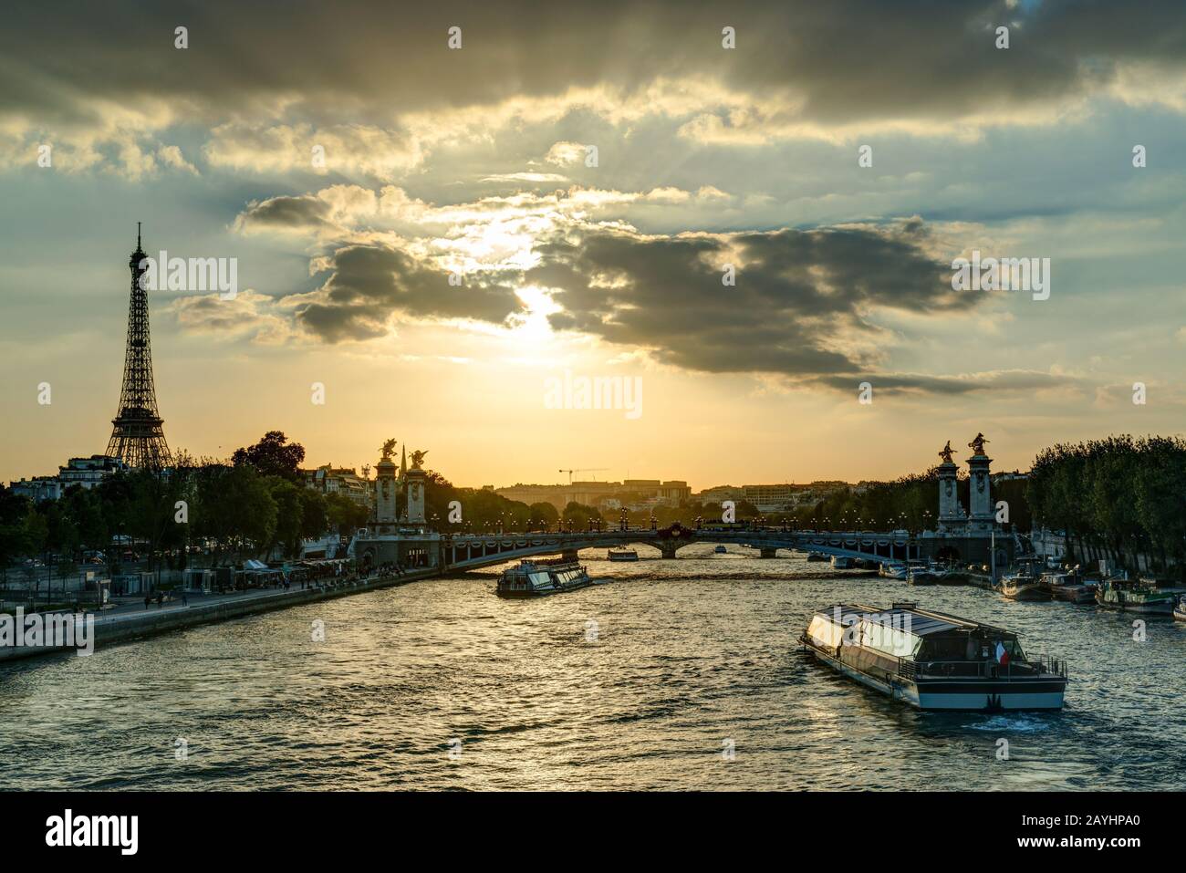 The River Seine with the Eiffel tower at sunset in Paris Stock Photo ...