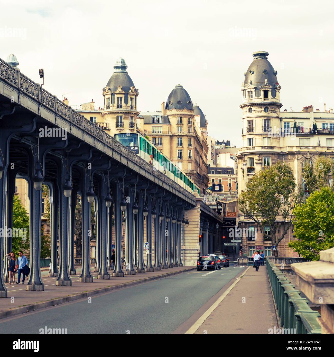 PARIS - SEPTEMBER 20, 2013: Old street, metro runs high between ...