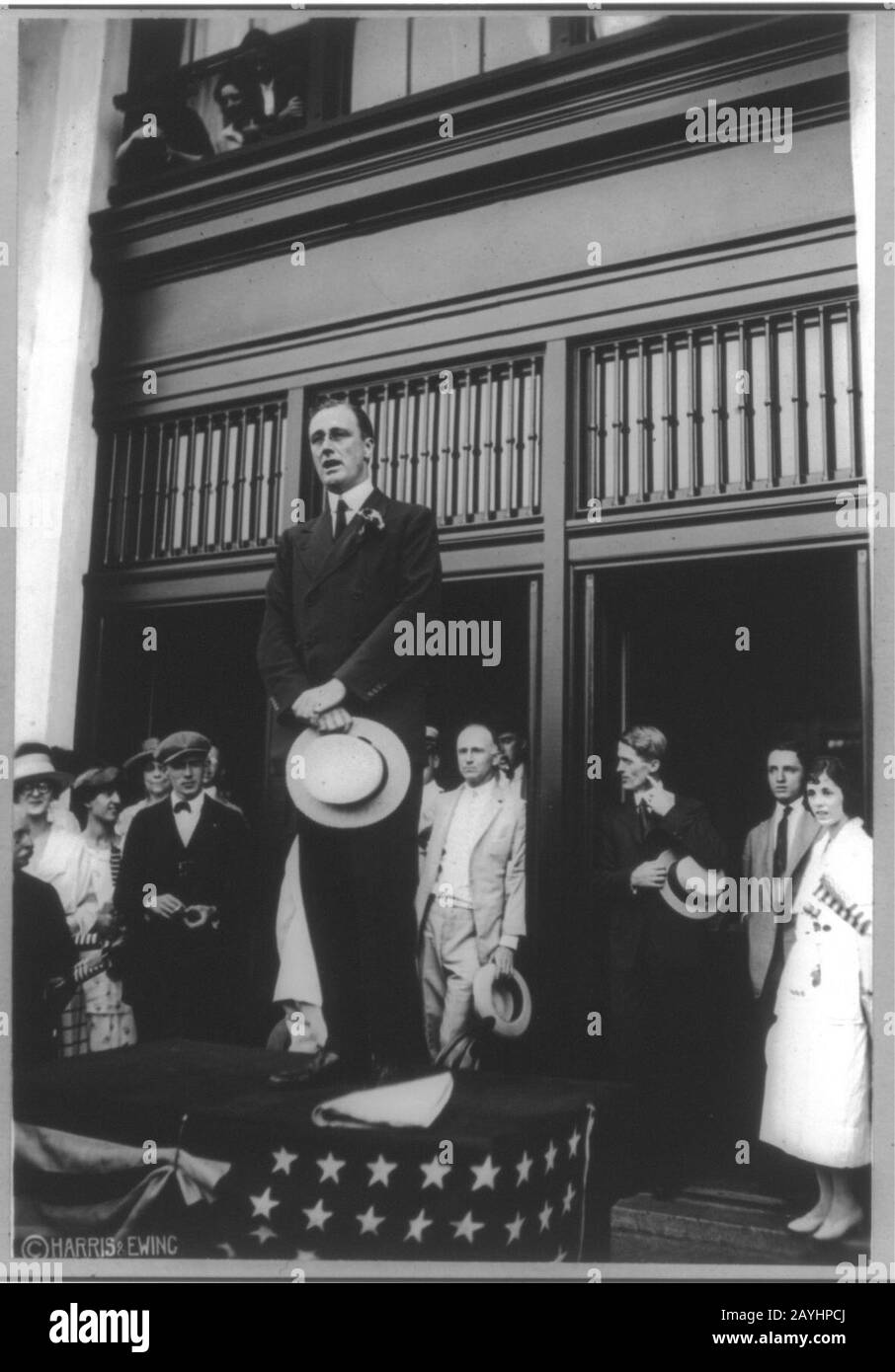Franklin D. Roosevelt, full length, standing, facing left; holding hat ...