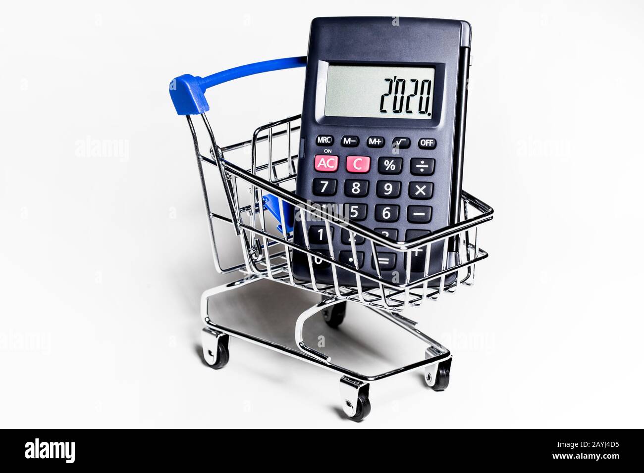 calculator in a shopping cart on white background Stock Photo - Alamy