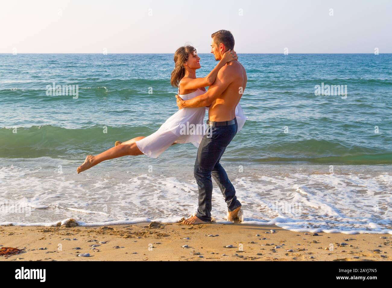 Summer afternoon at a sandy beach with the ocean in the background, a ...
