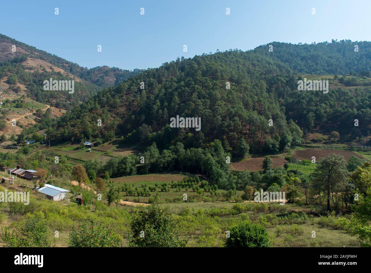View of a houses and fields at the Mixtec village of San Juan Contreras ...
